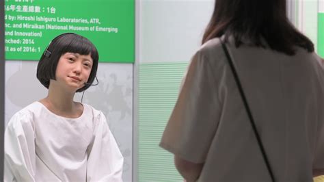 A Visitor Looks At The Japanese Kodomoroid Robot During The Robots