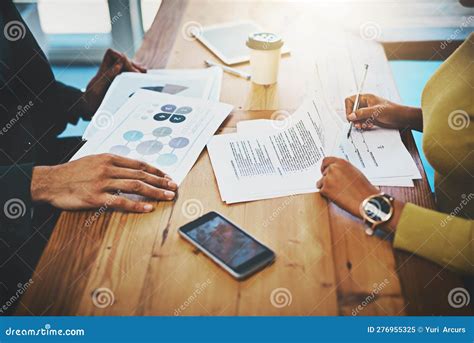 Theyve Got Productivity Covered A Man And Woman Completing Paperwork