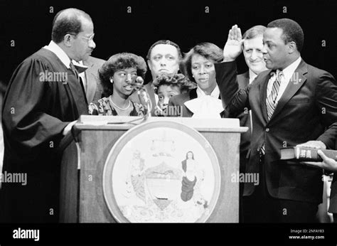 W Wilson Goode Right Raises His Hand As He Takes The Oath Of The