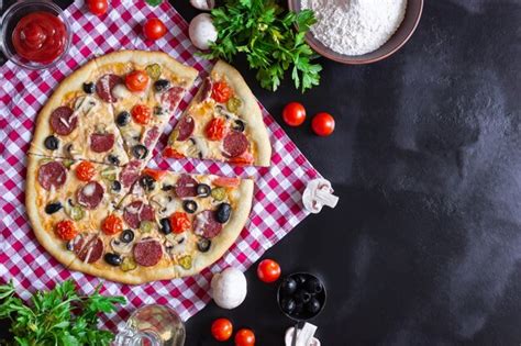 Premium Photo Homemade Pizza With Salami Mushrooms And Cherry
