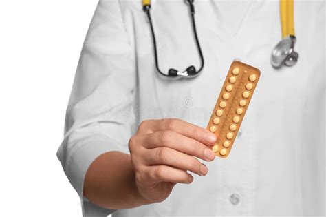 Doctor Holding Blister Of Oral Contraception Pills Against White
