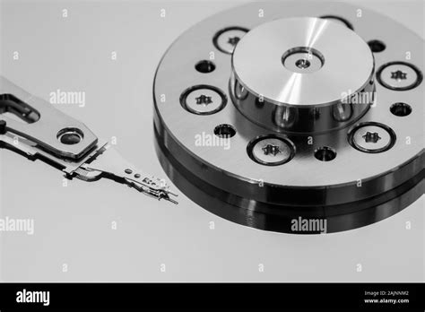 closeup macro of the tiny parts on a hard disk drive read write head