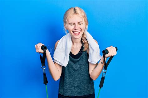 Beautiful Caucasian Sports Woman With Blond Hair Training Arm