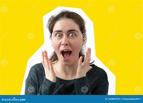 The Young Woman Opened Her Mouth In Surprise Yellow Background The
