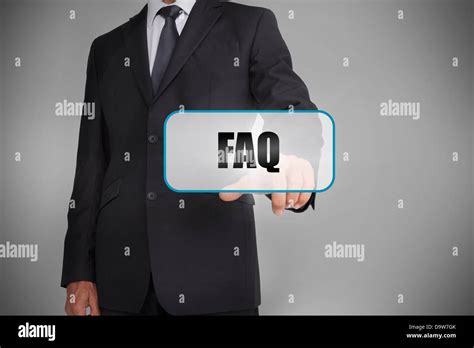 Businessman Selecting Tag With Faq Written On It Stock Photo Alamy