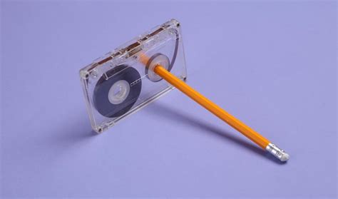 Premium Photo Audio Cassette Tape With Pencil On A Purple Background 80s
