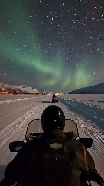 Snowmobiling Under The Northern Lights A Winter Adventure Premium Ai