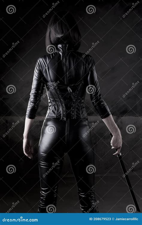 Sexy Killer Female Assassin With A Gun Wearing Black Leather Royalty