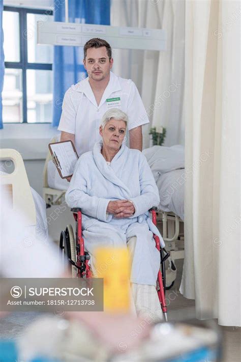 Nurse With Elderly Female Patient In Wheelchair Superstock
