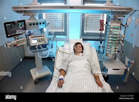 Intensive Care Unit In A Hospital A Patient Is Connected To Stock