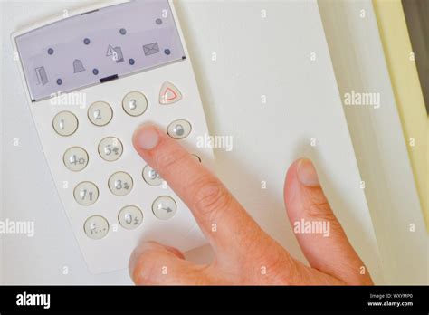 Hand Is Setting Home Security Alarm System Stock Photo Alamy