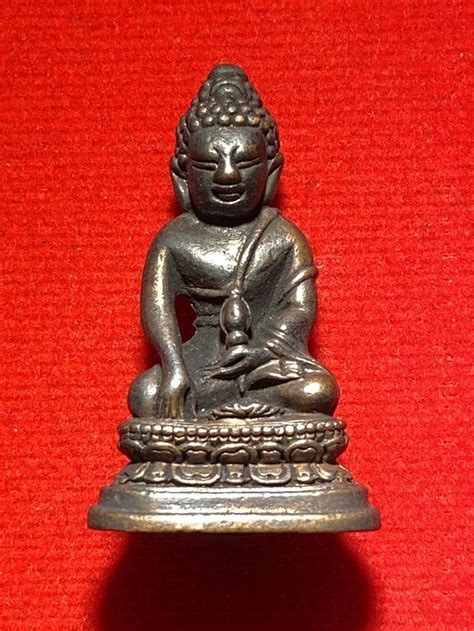 เนื้อทองแดงรมดำ พระพุทธนวมมหาราชายุจฉับปริวัตนมงคล พระกริ่ง ภ ป ร ในหลวง ร ๙ ๗๒ พรรษา Ennxo