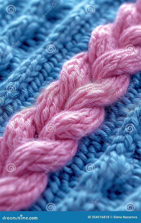 Close Up Of Pink Braid Pattern On Blue Knitted Fabric Texture Stock