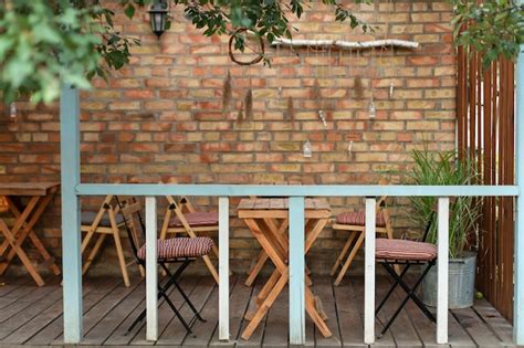Premium Photo Interior Cozy Space In Patio With Wooden Table And