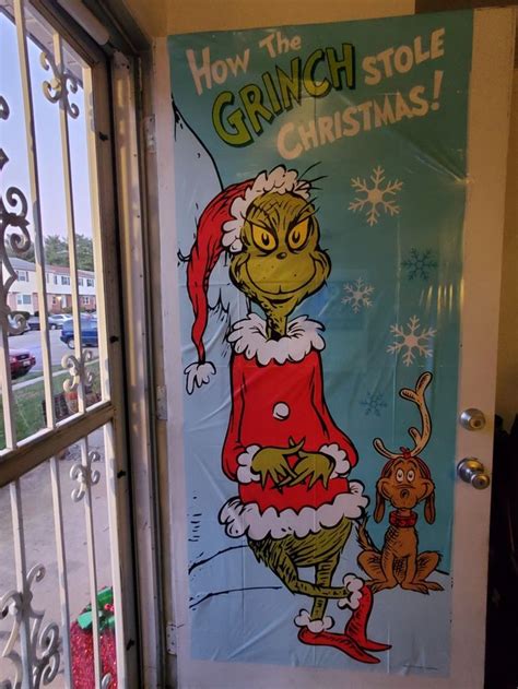 The Grinch Stole Christmas Door Cover Is On Display In Front Of An Iron