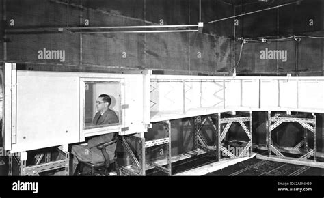 Acoustics Test Researcher Sitting Inside An Acoustics Duct Being Used