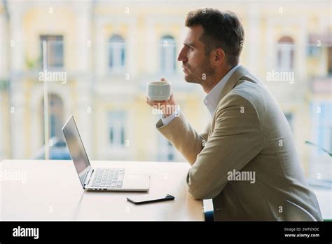 Elegant Confident Businessman Or Stock Trader Analyzing Stock Graph