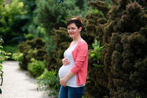 Premium Photo Beautiful Pregnant Girl Walks In The Park