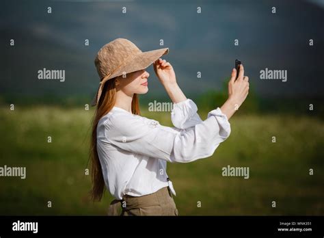 Woman Using Mobile Phone At Outdoor Using A Smartphone To Navigate The