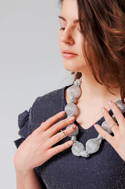 Premium Photo Close Up Of Beautiful Woman Wearing Necklace Against