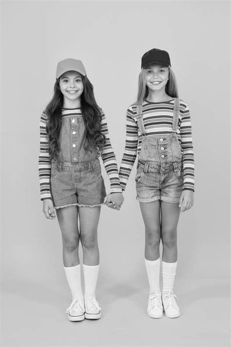 Friends Stick Together Happy Girls Friends Holding Hands On Yellow