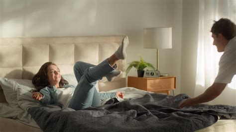 Woman Lying On Bed Bedroom Laughing Relax Man Jump Hug Happy Couple Together Love Weekend