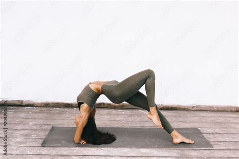 Attractive Model In Yoga Pose On White Background In Sexual Clothes Stock Photo Adobe Stock