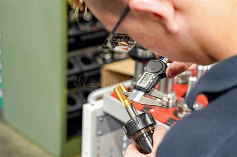 Checking The Dimensions Of The Cutting Tool With A Caliper For Metalworking Cnc Milling And