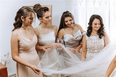 Premium Photo Bridesmaids Rejoice In The Morning Helping To Fasten