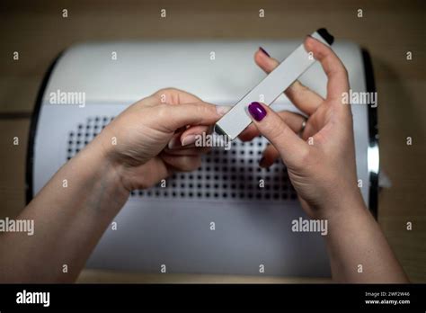 Close Up Of Unrecognisable Female Removing Her Own Nail Polish With