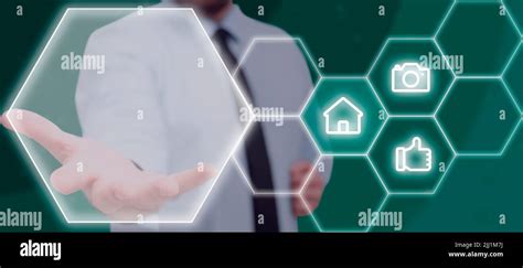 Businessman Extending Hand Showing Homepage And Other Symbols In An