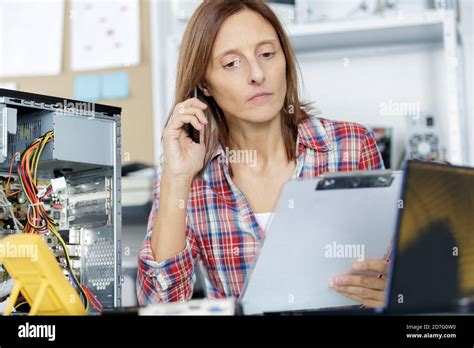 A Woman Fixing A Pc Stock Photo Alamy