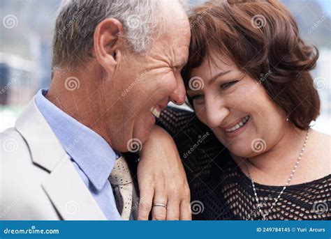 Sharing A Laugh Closeup Of A Mature Couple Sharing An Intimate Happy