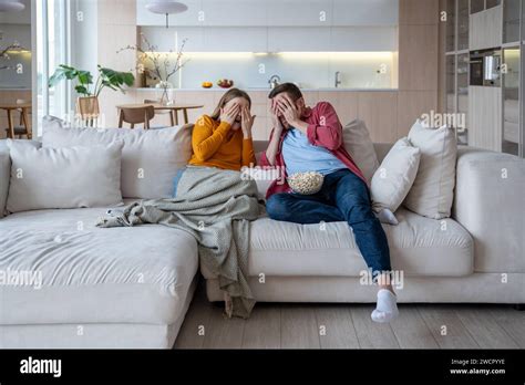 Scared Man Woman Closing Faces With Hands Watching Horror Movies Eating Popcorn Home Cinema