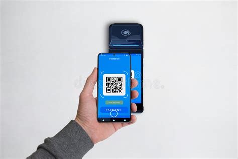 Smartphone Scanning A Qr Code On A Pos Terminal To Complete A Payment