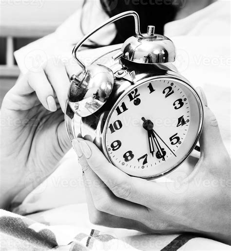 Woman In A Bed Setting The Alarm Clock 17157789 Stock Photo At Vecteezy