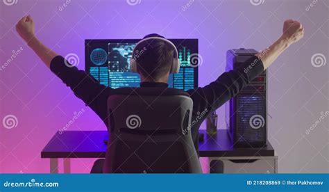 Man Programmer In Headphones Happy With Success While Working At A