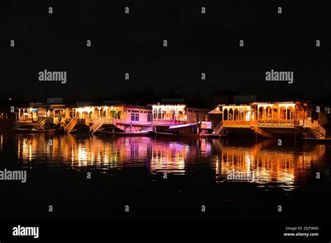 A Late Night View Of The Illuminated Floating Houseboats On Dal Lake In