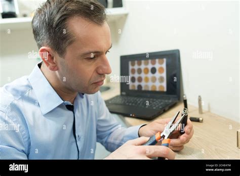 Man Fixing Circuit Board Using Screwdriver Stock Photo Alamy