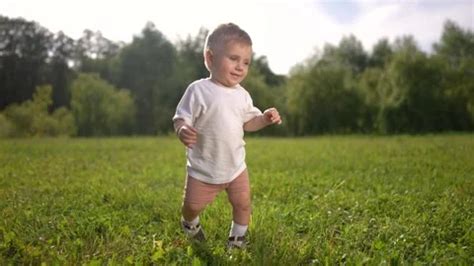 A Baby Is Taking The First Steps In A Pa Stock Video Pond