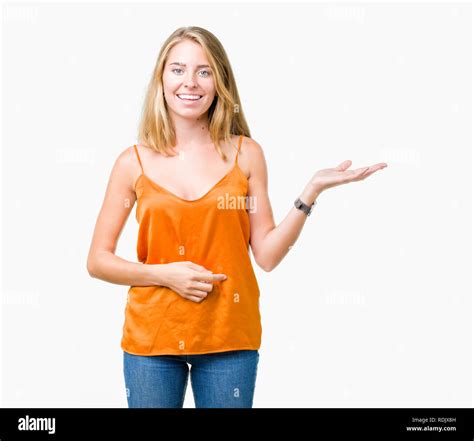 Beautiful Young Woman Wearing Orange Shirt Over Isolated Background