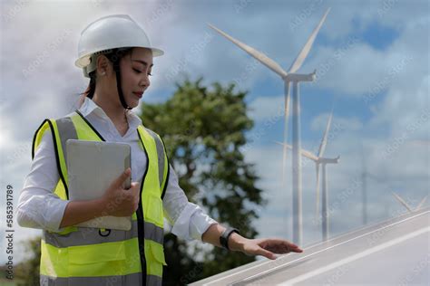 Asia Woman Engineer On Solar Panel Clean Energy Woman Engineer Checking Solar Cell With Solar