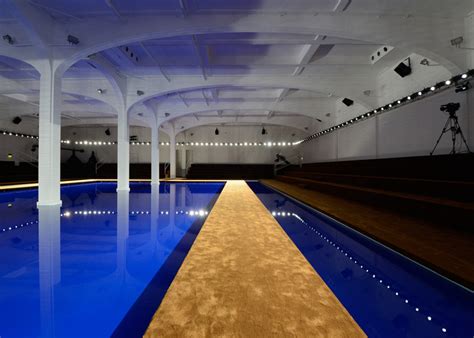 rem koolhaas floats prada ss15 catwalk on blue pool