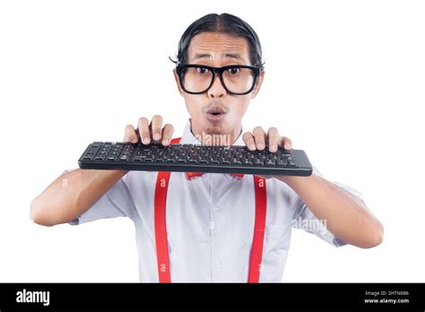 Asian Nerd With An Ugly Face Holding Keyboard Isolated Over White