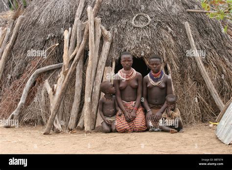Africa Ethiopia Omo Valley Daasanach Tribe Women In Front Of Hut Stock