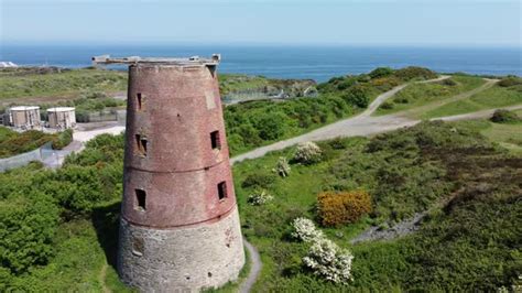 Amlwch Port Red Brick Disused Abandoned Windmill Aerial View North Anglesey Wales Close Orbit