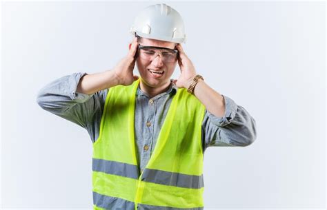 Premium Photo Male Engineer With Headache On Isolated Background