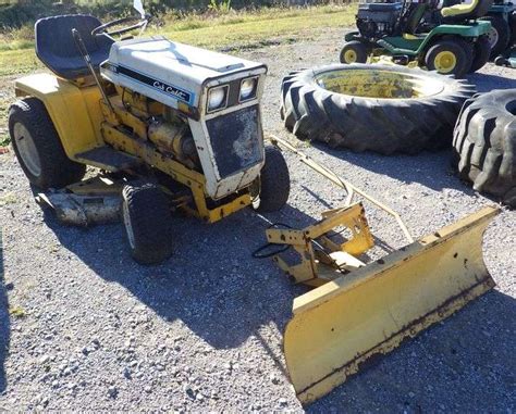 Old Cub Cadet 126 Lawn Mower With Cub Cadet Snow Blade Attachment Front Tire Is Flat Mower Not
