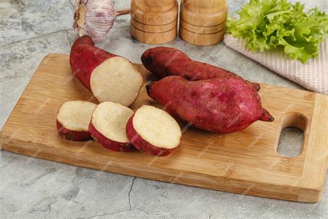 Premium Photo Raw Red Batat With Slices