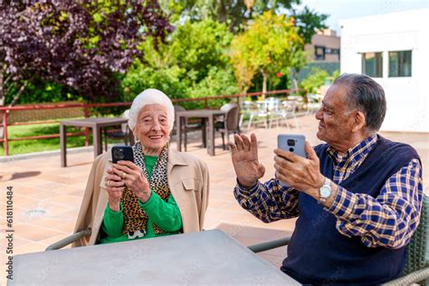 Radiating Pure Bliss An Elderly Man And Woman Connect With Loved Ones